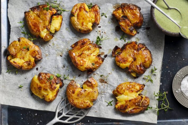 Smashed roasties with green goddess sauce